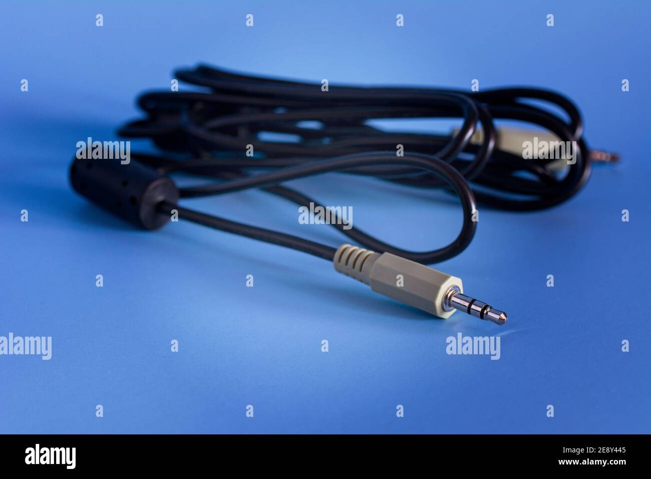 Black aux audio cable on the blue background. Standard 3.5mm Male to ...