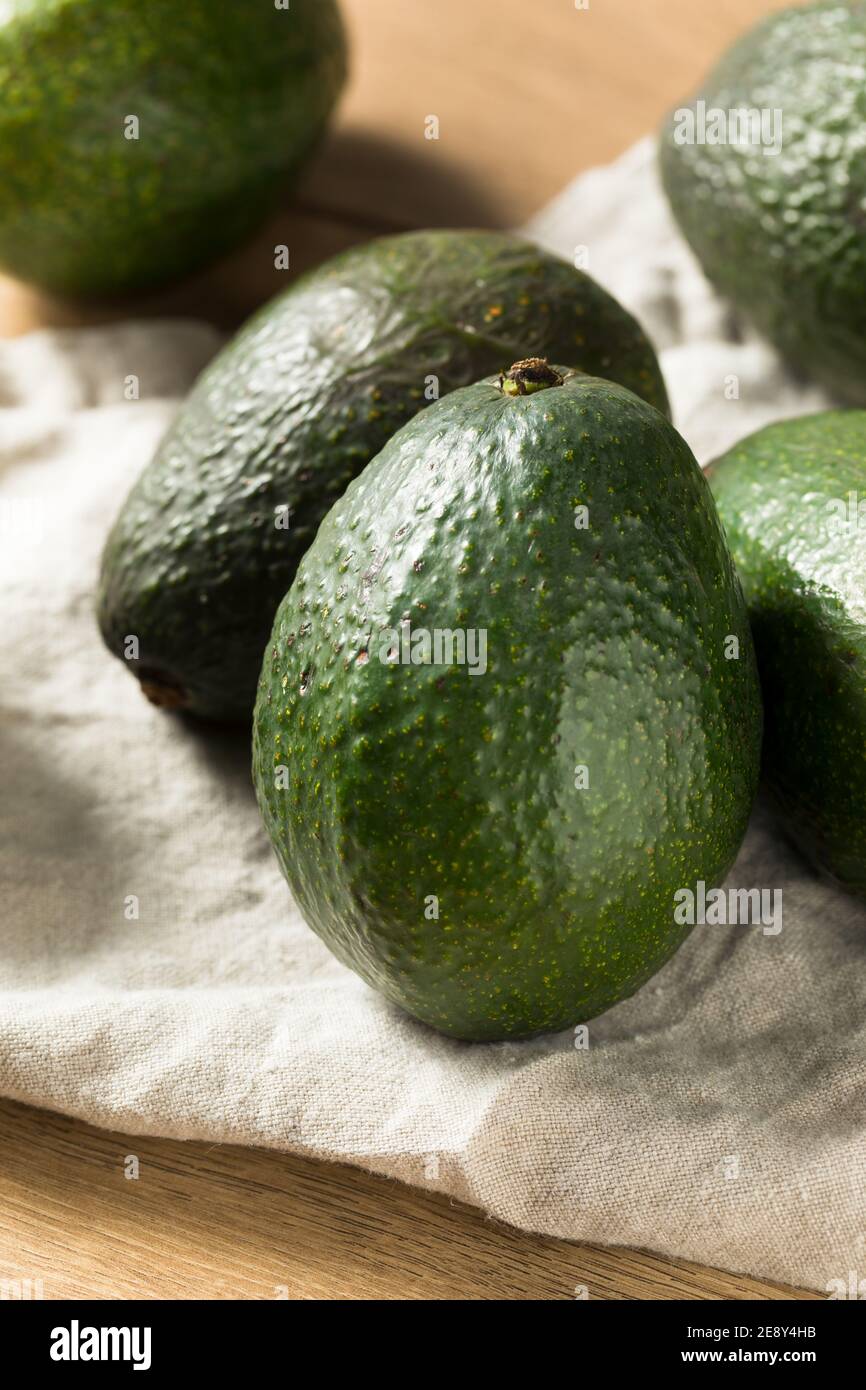 Raw Green Organic Avocados in a Bunch Stock Photo - Alamy