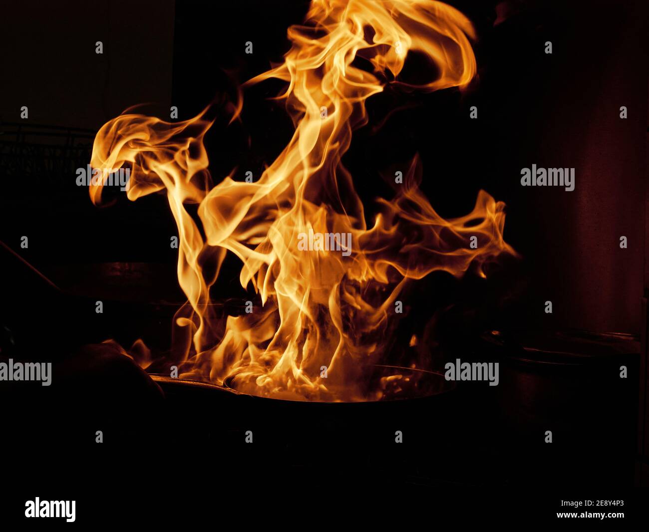 Flambe Chef Cooking in Outdoor Kitchen. Professional chef in a ...