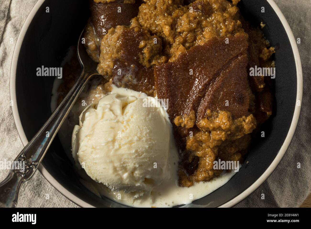 Homemade Cornmeal Indian Bread Pudding with Ice Cream Stock Photo - Alamy