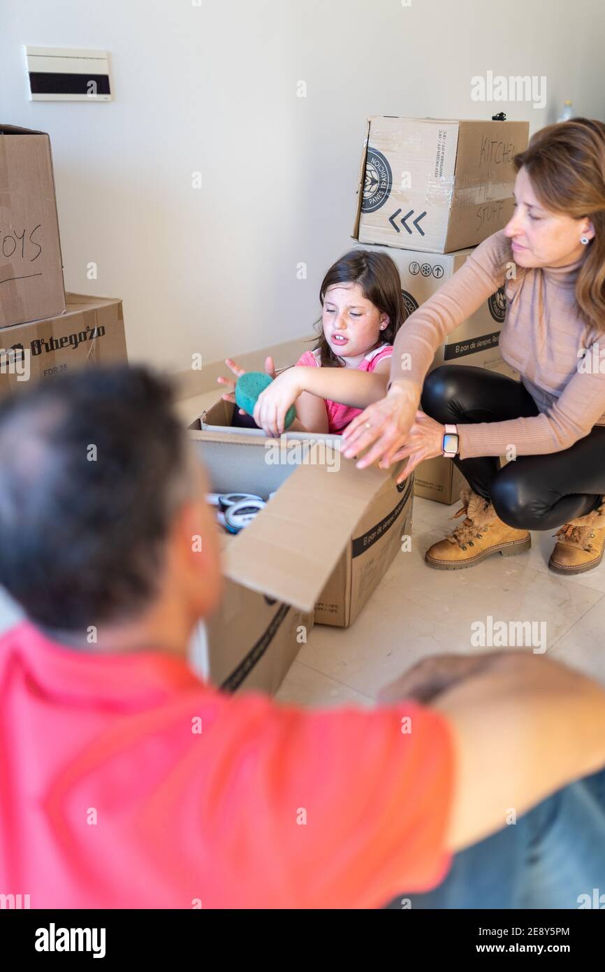 Family playing in their new house Stock Photo - Alamy