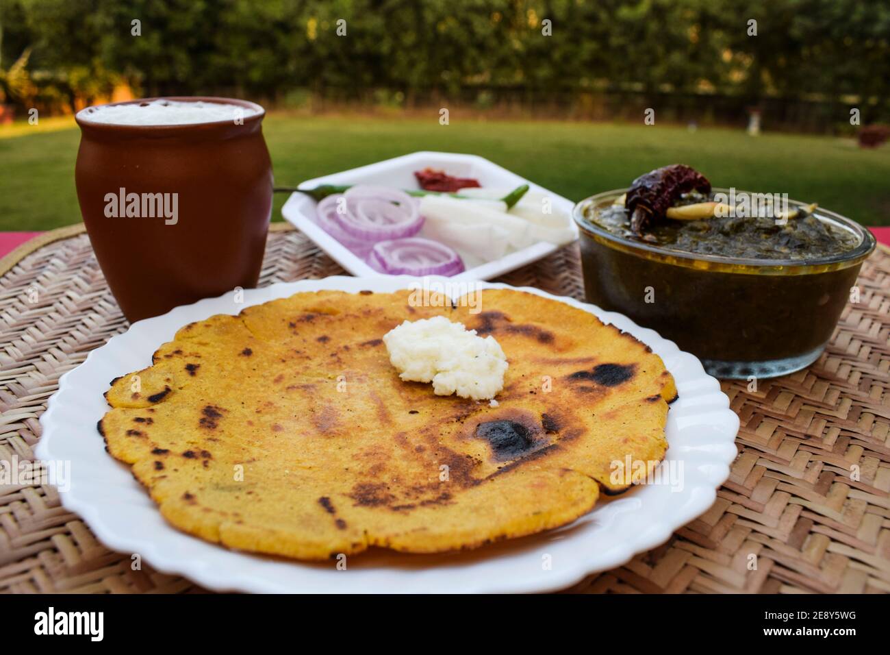 Side view of makki di roti and Sarson da saag, mustard leaves curry and ...