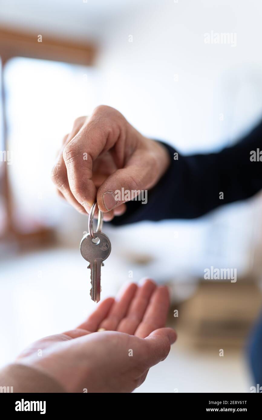 State agent giving keys to a new lady's house Stock Photo - Alamy