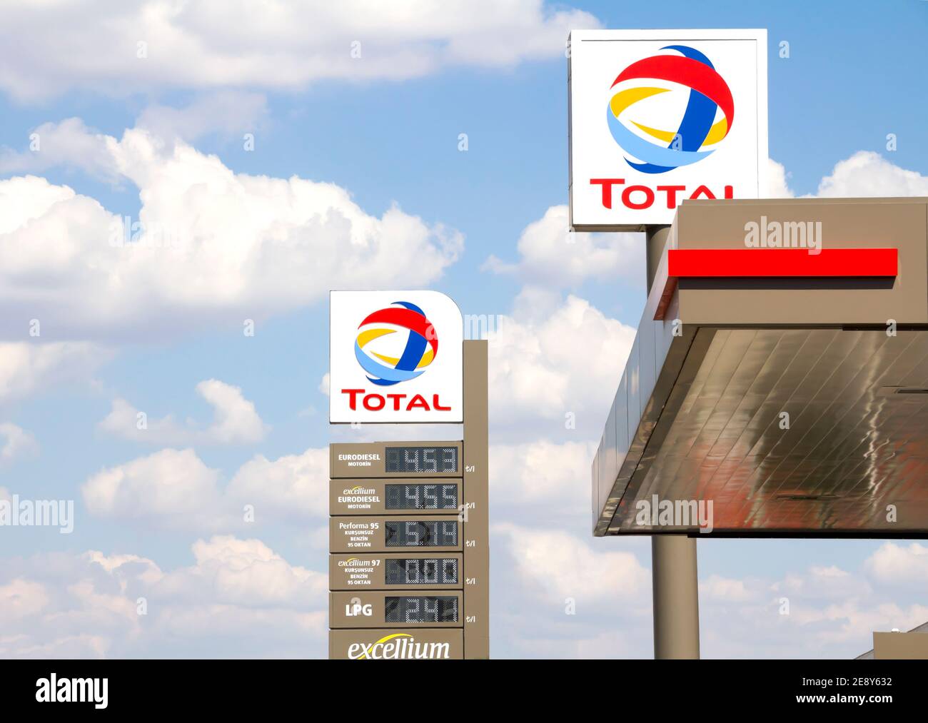 Total sign identifying a gas station. Total is a French multinational ...