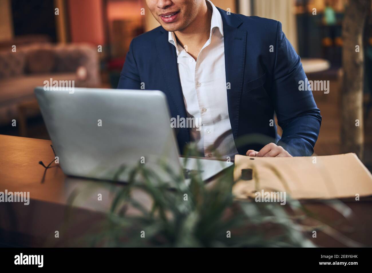 Elegant remote worker sitting before his computer Stock Photo - Alamy
