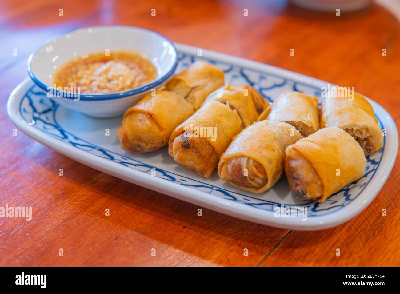 Fried chinese spring rolls with sweet chili sauce Stock Photo - Alamy
