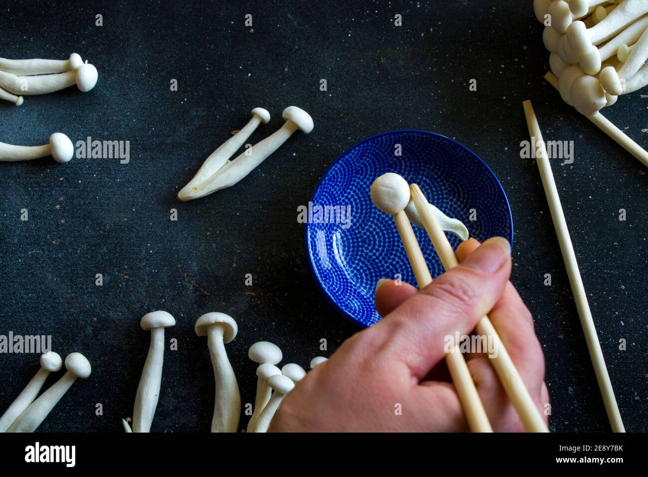 White Asian Enoki mushroom, raw vegan food, fungus Stock Photo - Alamy