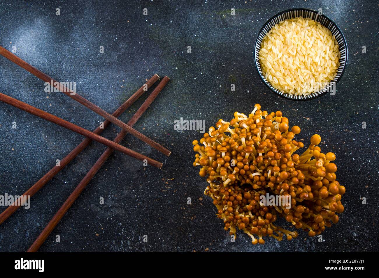 Golden brown Asian Enoki mushrooms, vegetable background, fungus Stock ...