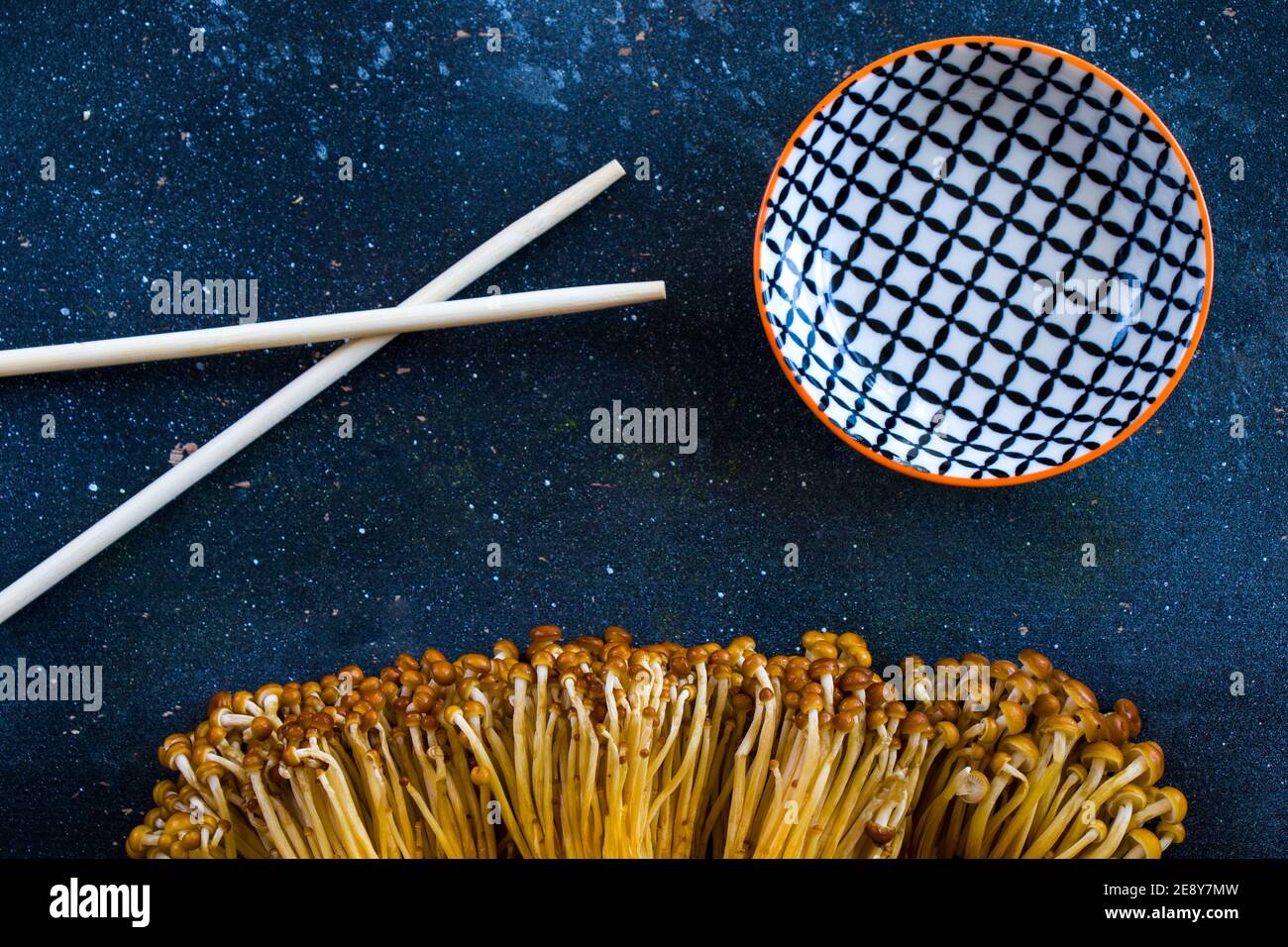Golden brown Asian Enoki mushrooms, vegetable background, fungus Stock ...