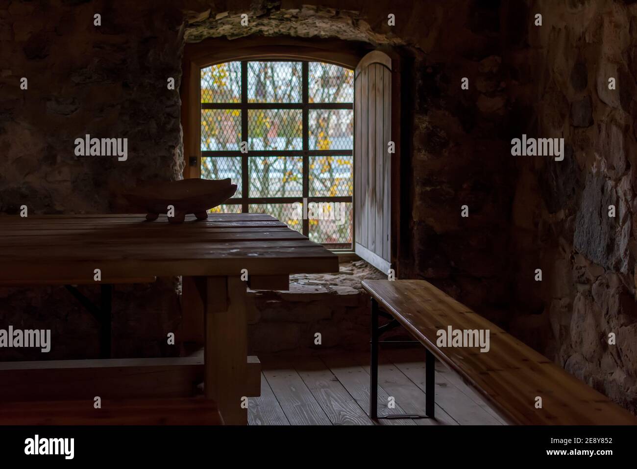 Interiors of Sigulda Medieval Castle, Latvia with wooden table, bench ...