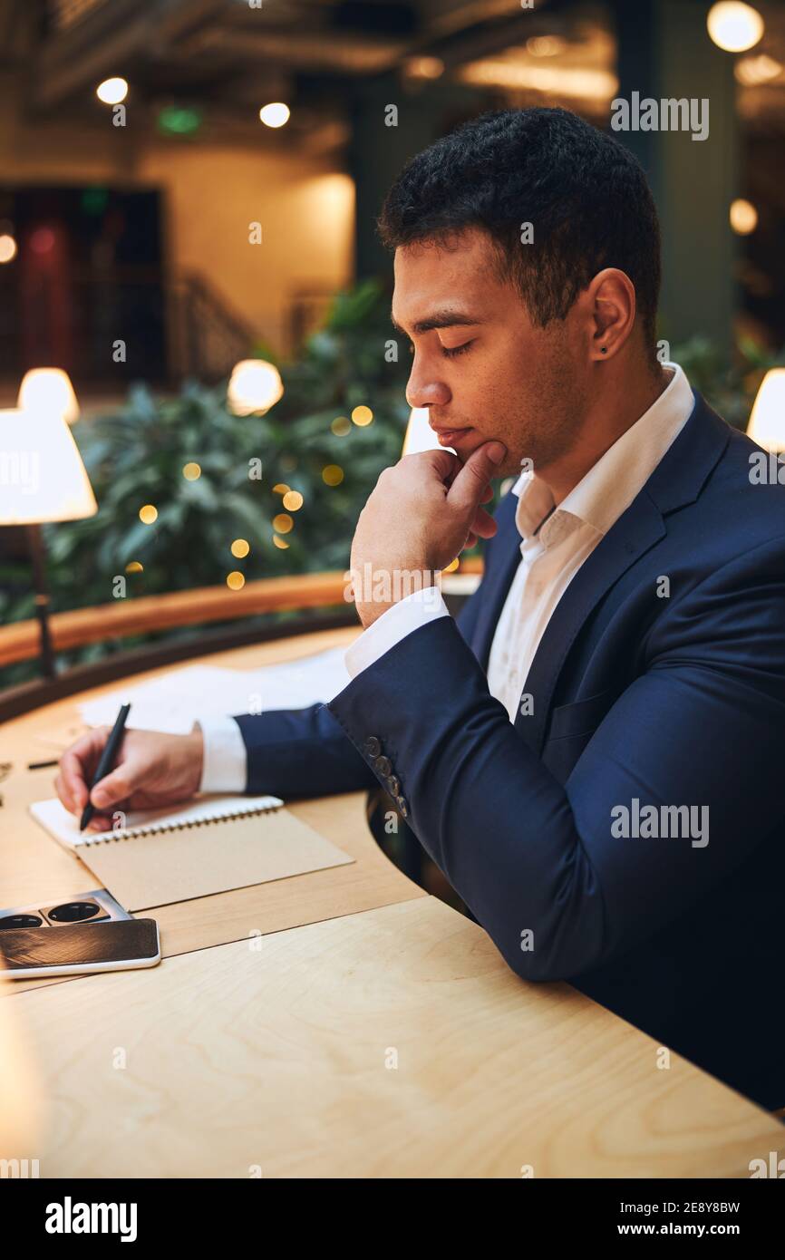 Handsome focused businessman writing hi-res stock photography and ...