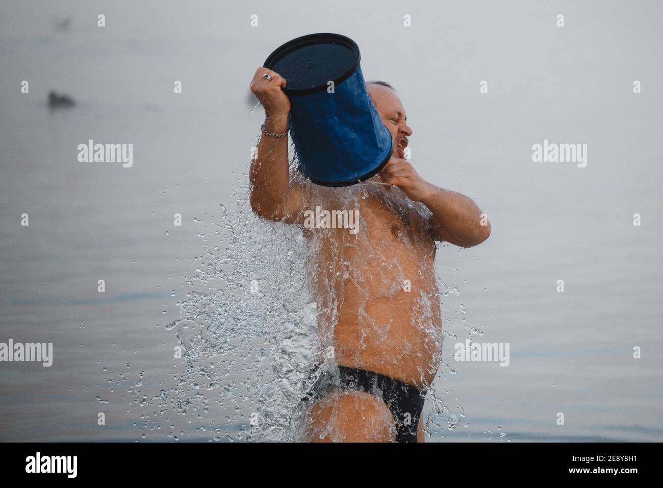 Moscow, Russia - January 15, 2019: man is tempered, dousing himself ...