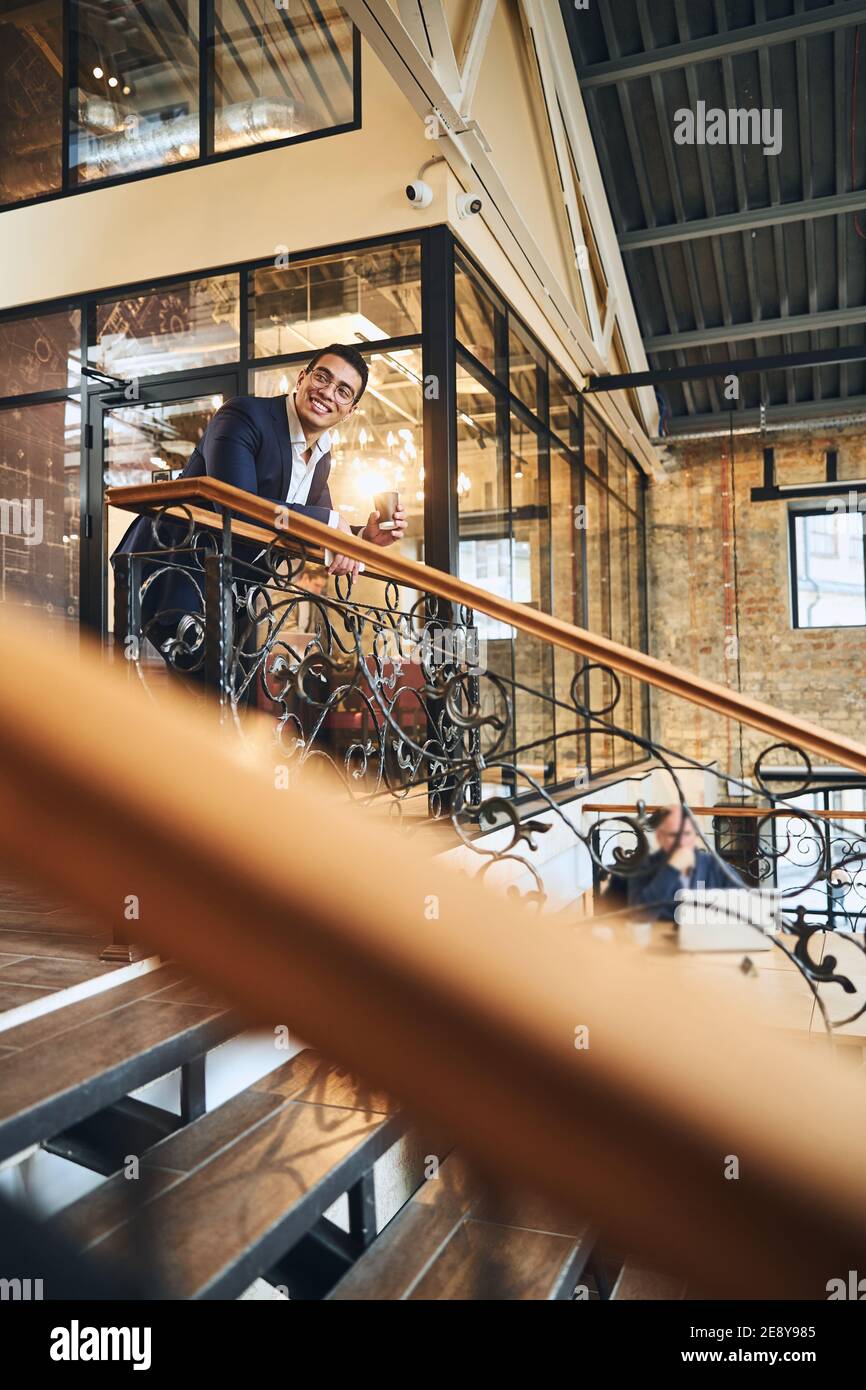 Man leaning on handrail hi-res stock photography and images - Alamy
