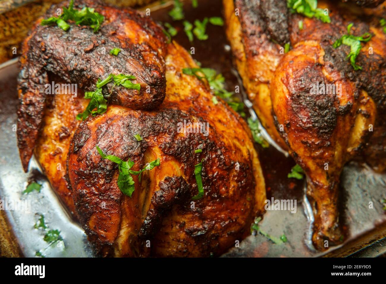 Cooking pan Peruvian roasted half chicken pollo a la brasa Stock Photo ...