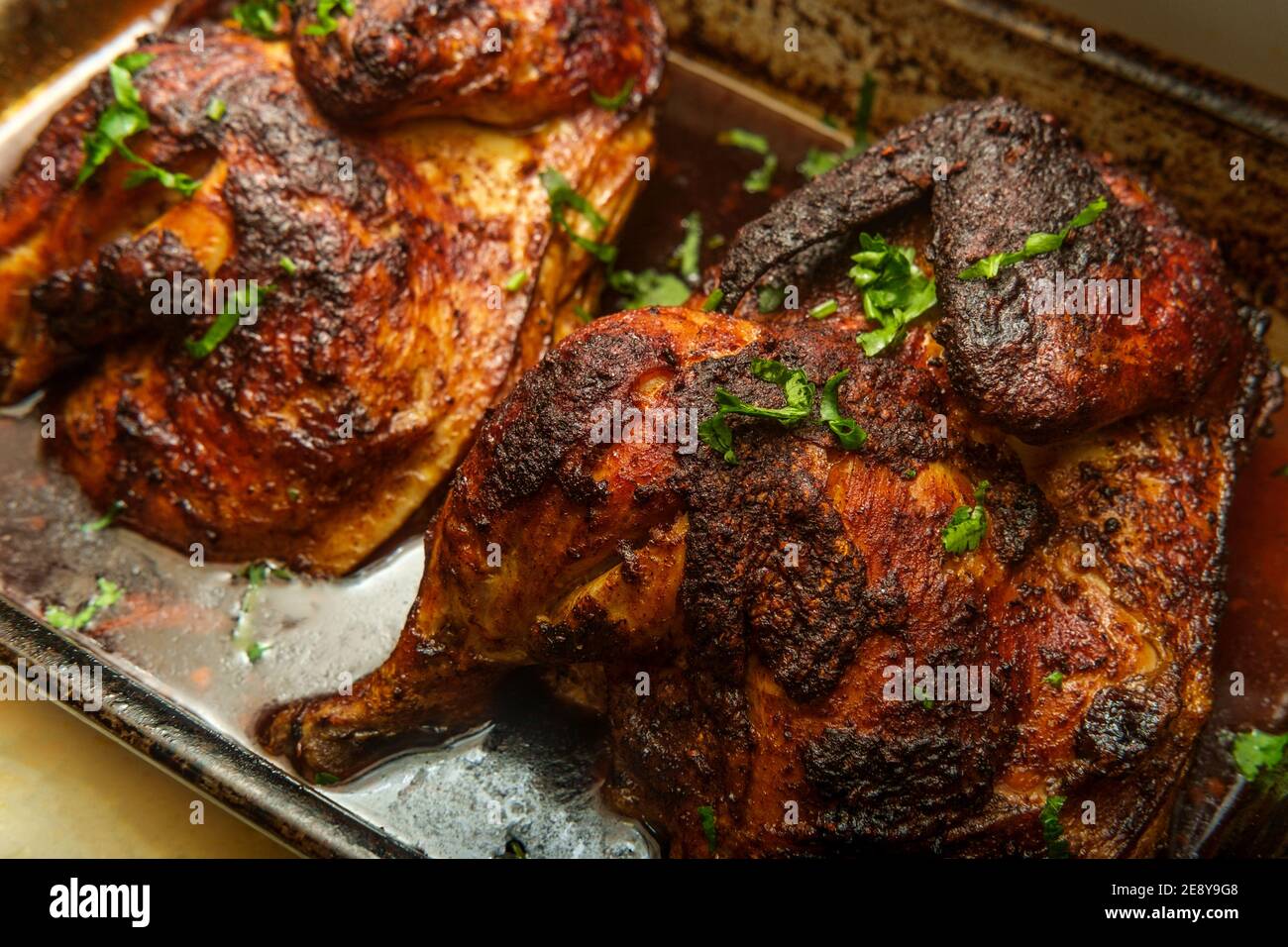 Cooking pan Peruvian roasted half chicken pollo a la brasa Stock Photo ...