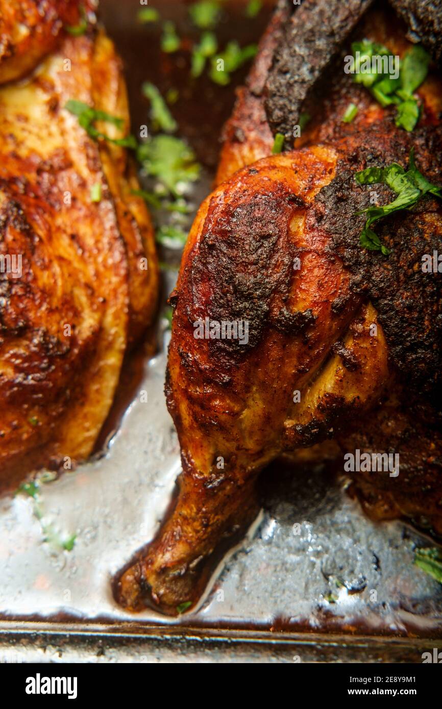 Cooking pan Peruvian roasted half chicken pollo a la brasa Stock Photo ...