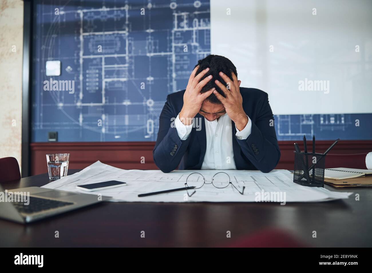 Employee having a bad headache at work Stock Photo - Alamy