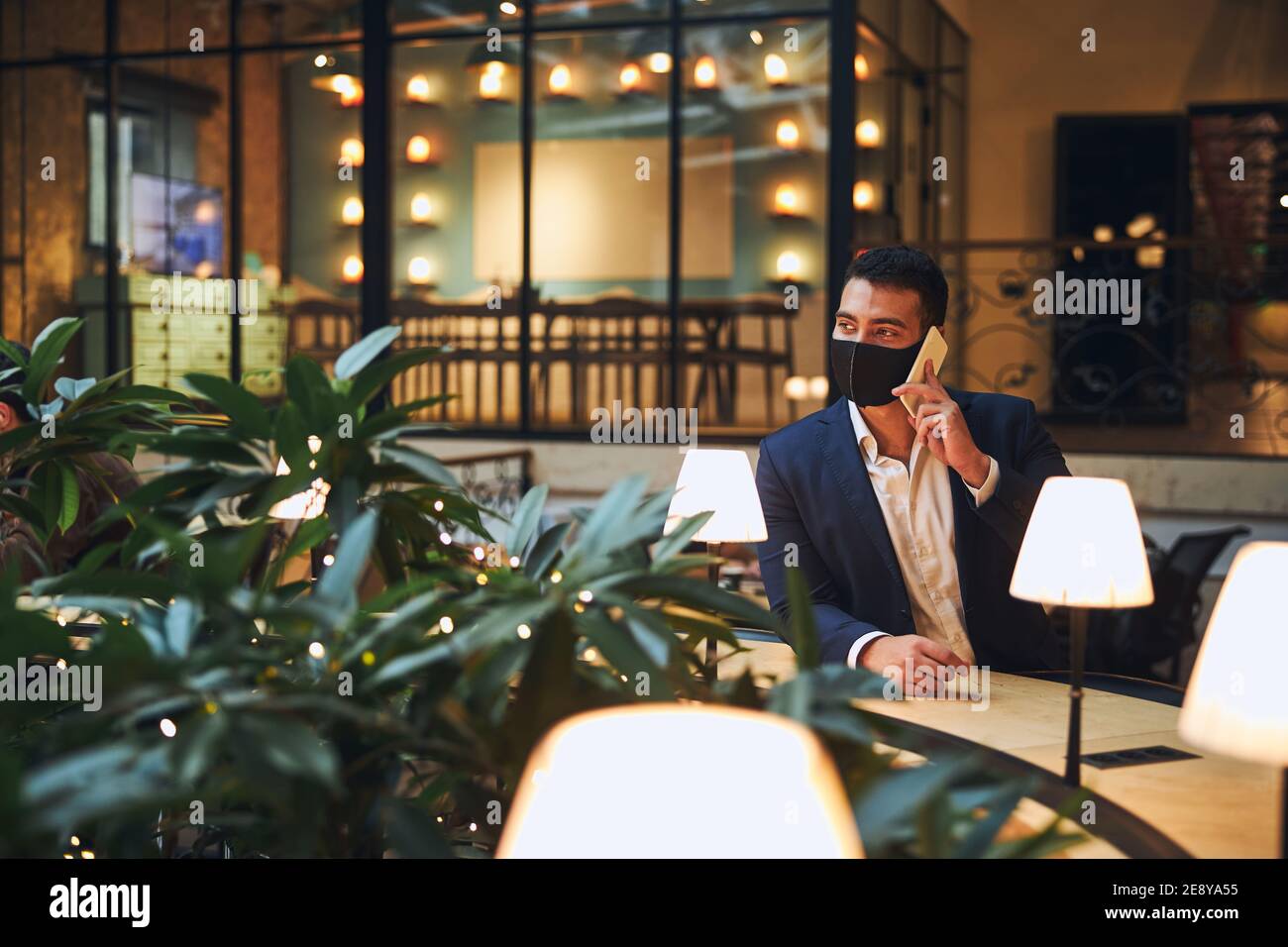 Covering face with cellphone hi-res stock photography and images - Alamy