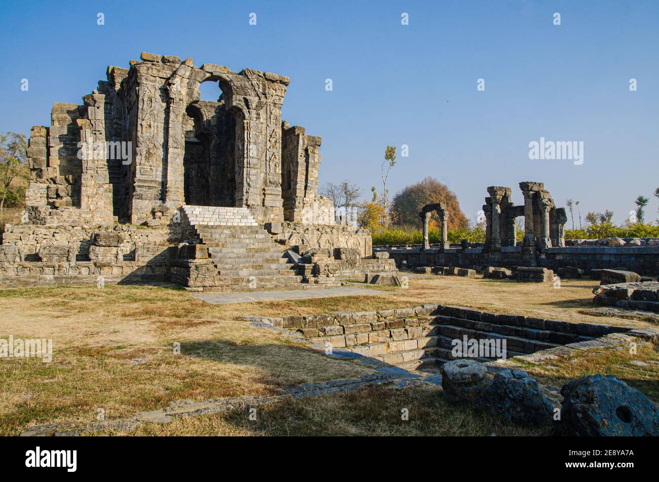 Ruins of the Martand Sun Temple under the sunlight and a blue sky in ...