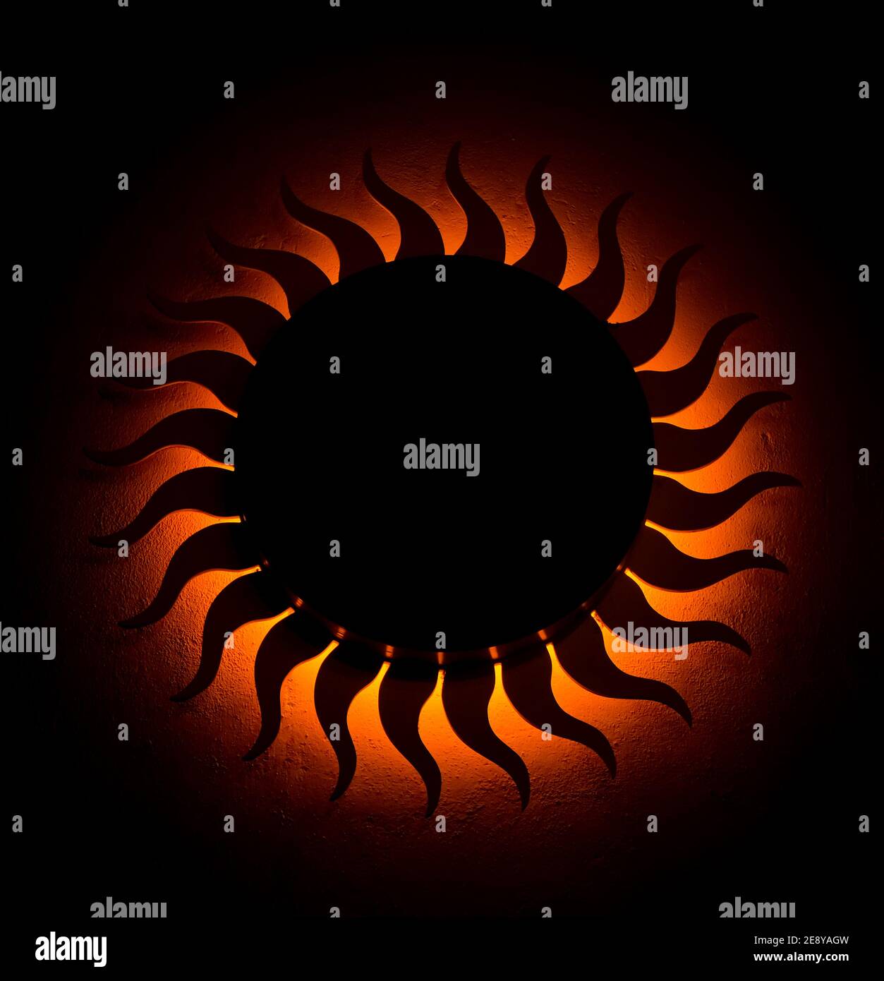 red sun with led on the wall Stock Photo - Alamy