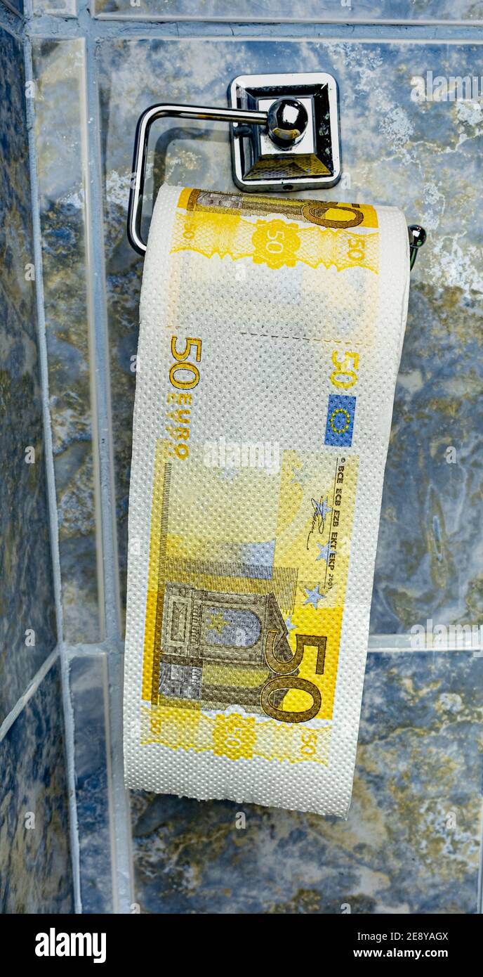 Roll of Euro bank notes toilet paper in bathroom Stock Photo - Alamy