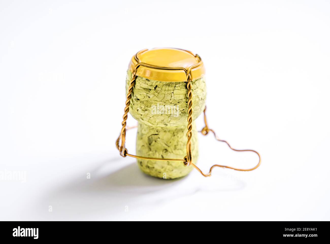 Champagne cork with wire cage isolated on white Stock Photo - Alamy