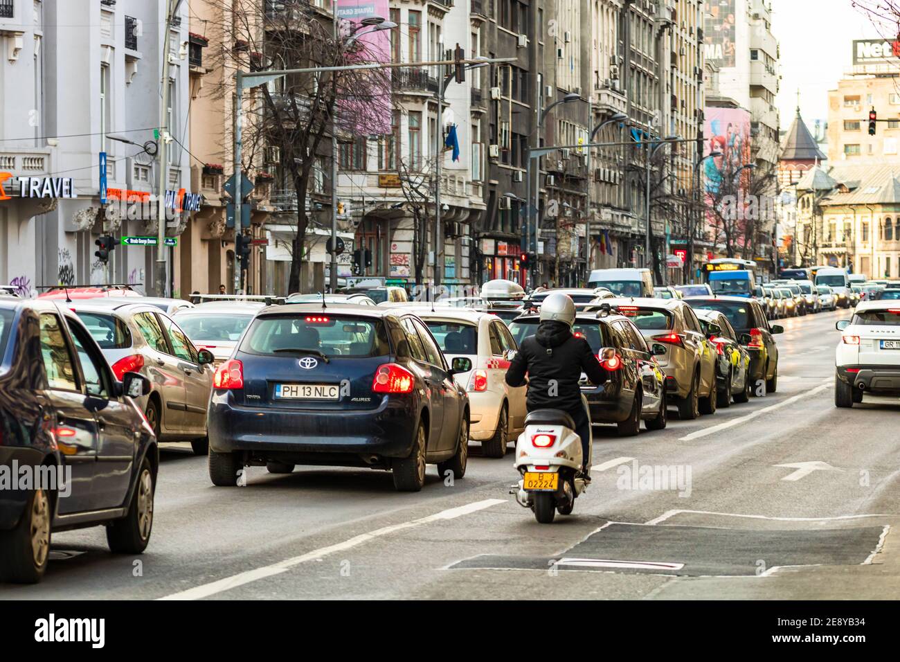 Car traffic at rush hour in downtown area of the city. Car pollution ...