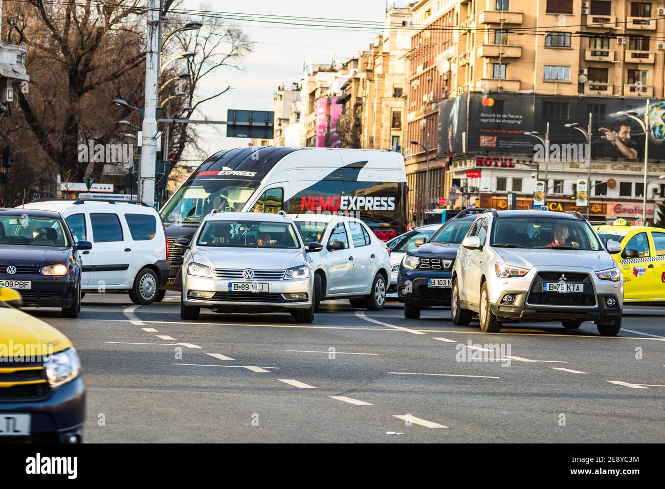 Car traffic at rush hour in downtown area of the city. Car pollution ...