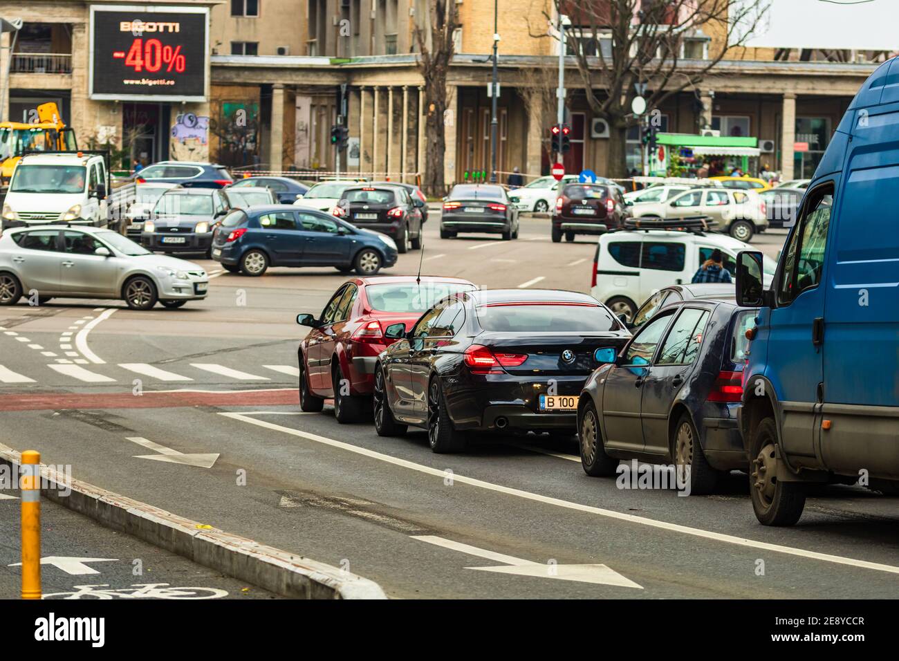 Car traffic at rush hour in downtown area of the city. Car pollution ...