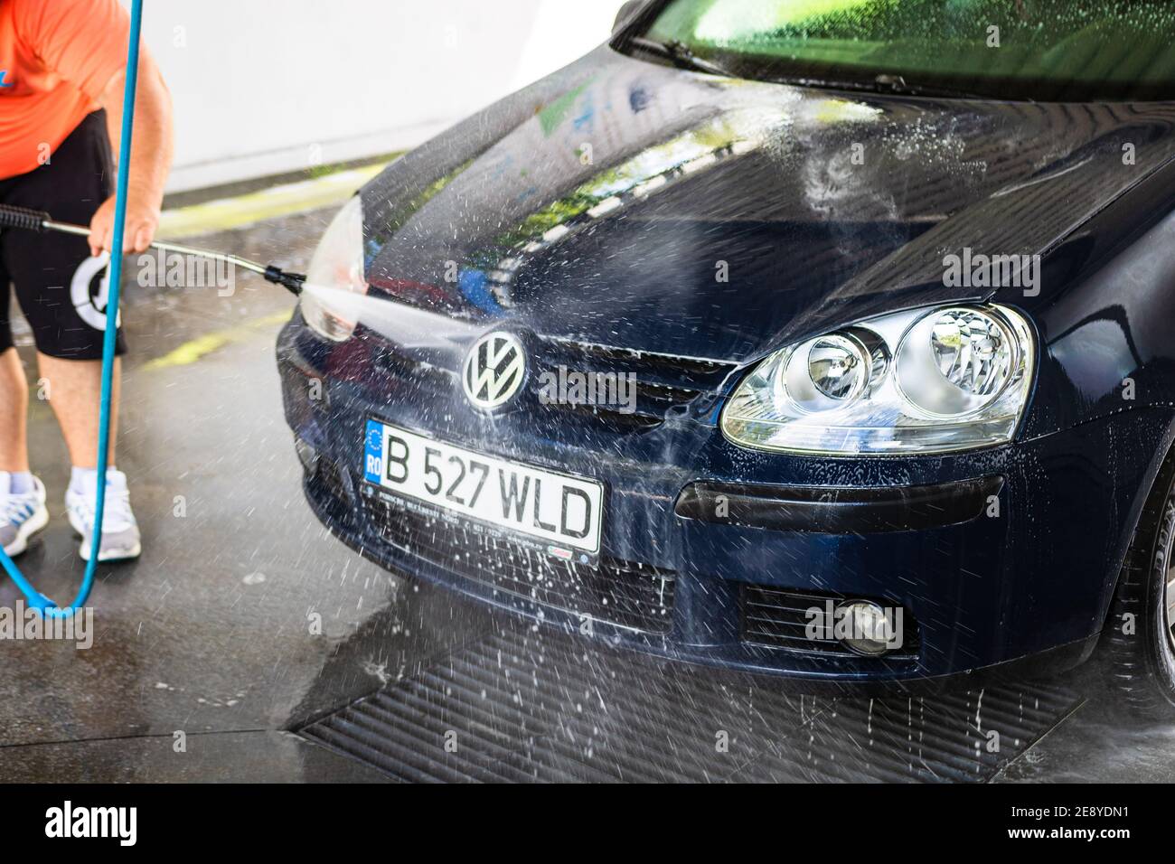 Washing and cleaning car in self service car wash station. Car washing ...