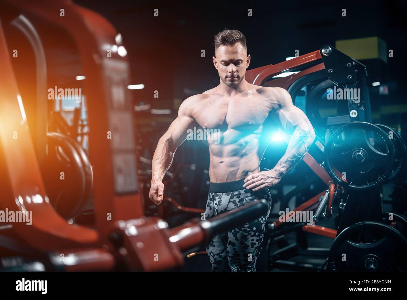 young athletic sportsman bodybuilder with muscle perfect body posing in ...