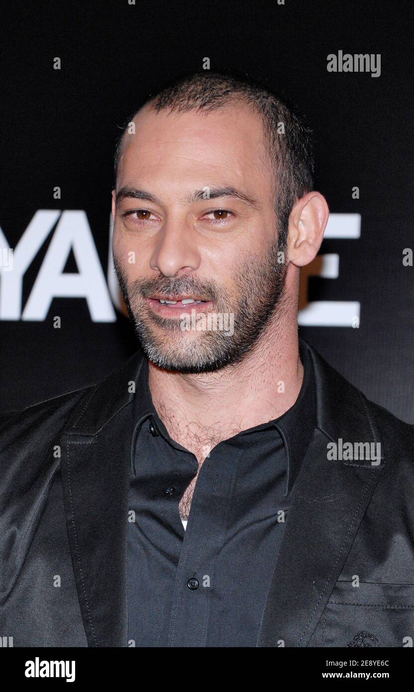 Cast member Ashraf Barhom poses for pictures at the French premiere for ...