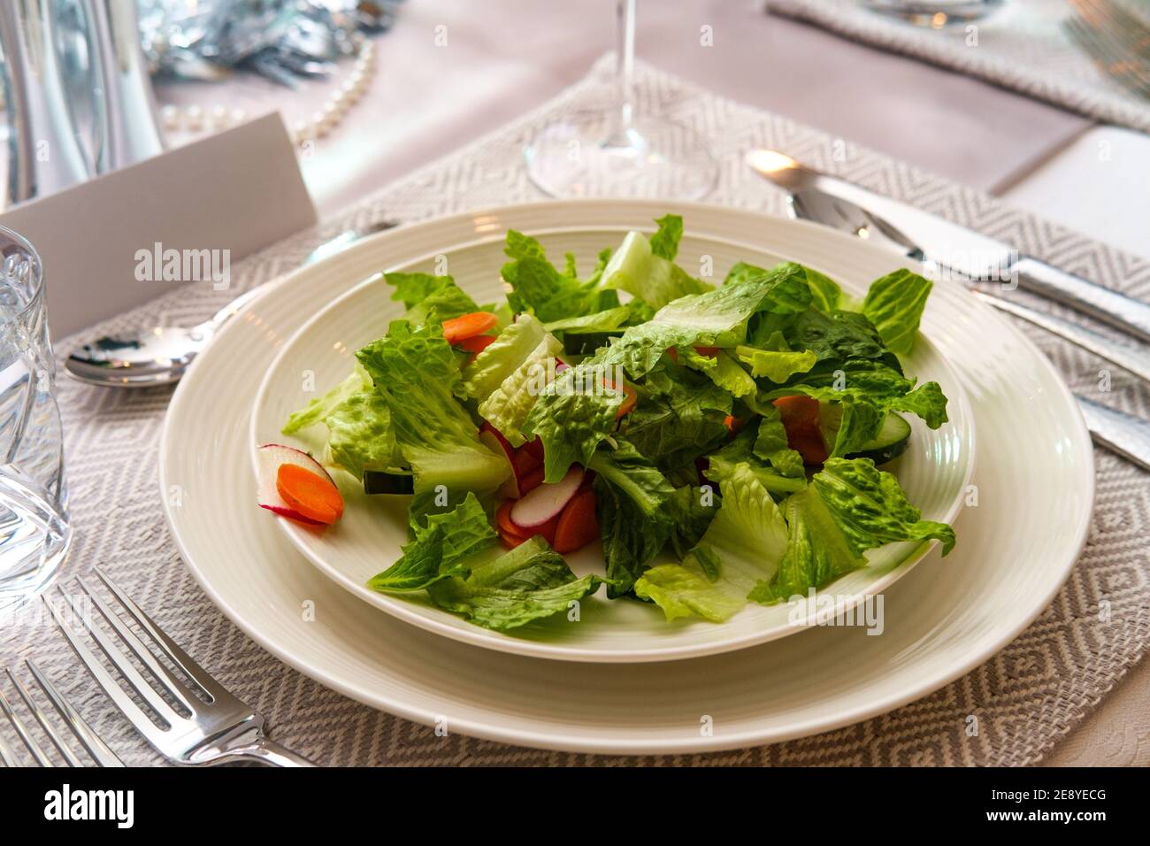 fancy gourmet restaurant dining first course garden salad table setting ...