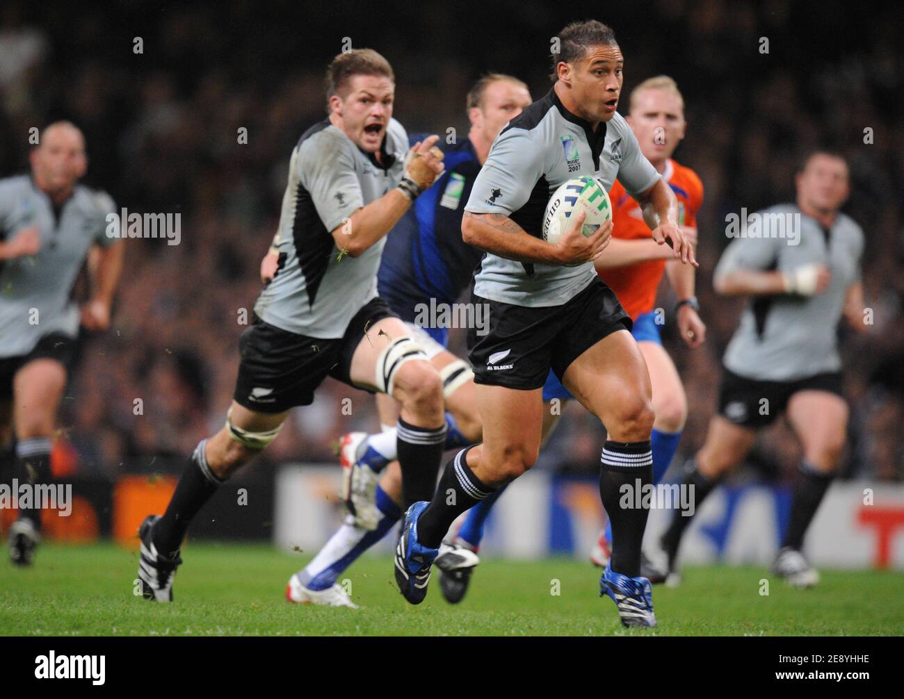 New Zealand's Luke McAlister scores a try during the IRB Rugby World ...