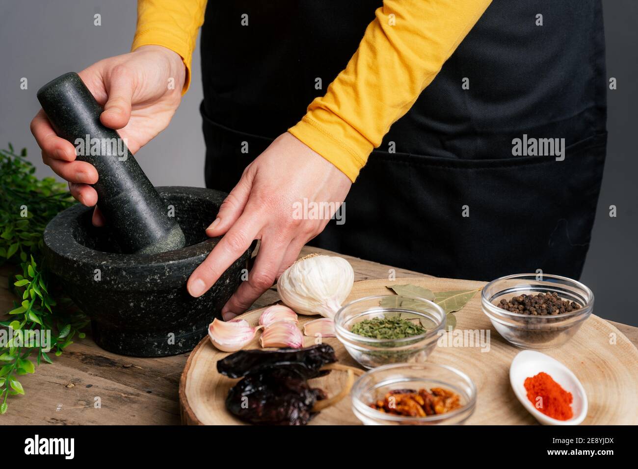Hands chef grinding spices hi-res stock photography and images - Alamy
