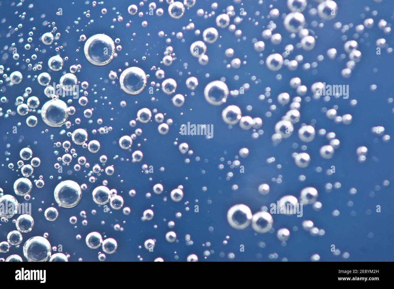 Bubbles from soda water or champagne, beer or other liquid with air ...