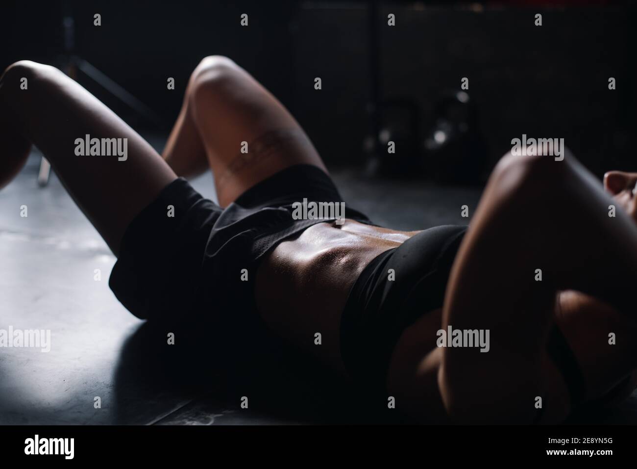 Young girl doing sports in the gym. Atmospheric gym Stock Photo - Alamy