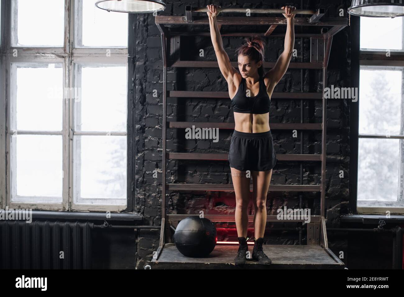 Young girl doing sports in the gym. Atmospheric gym Stock Photo - Alamy