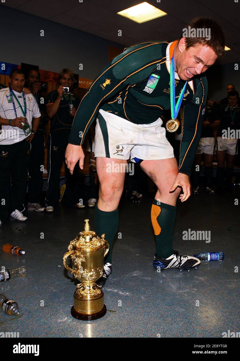 John Smit of South Africa places the trophy in the South African ...