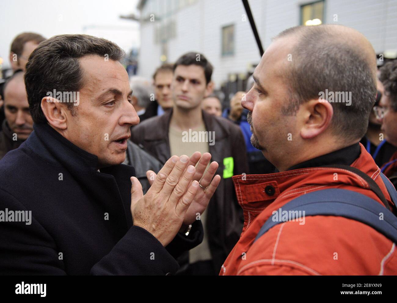 French President Nicolas Sarkozy (L) chats with a CGT trade union ...