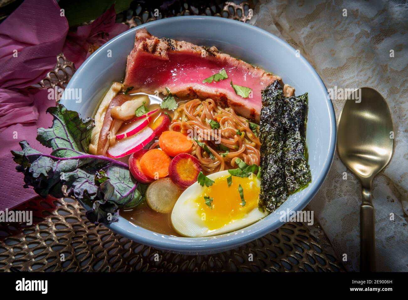 Seared pink ahi tuna ramen garnished with soft boiled egg seaweed ...