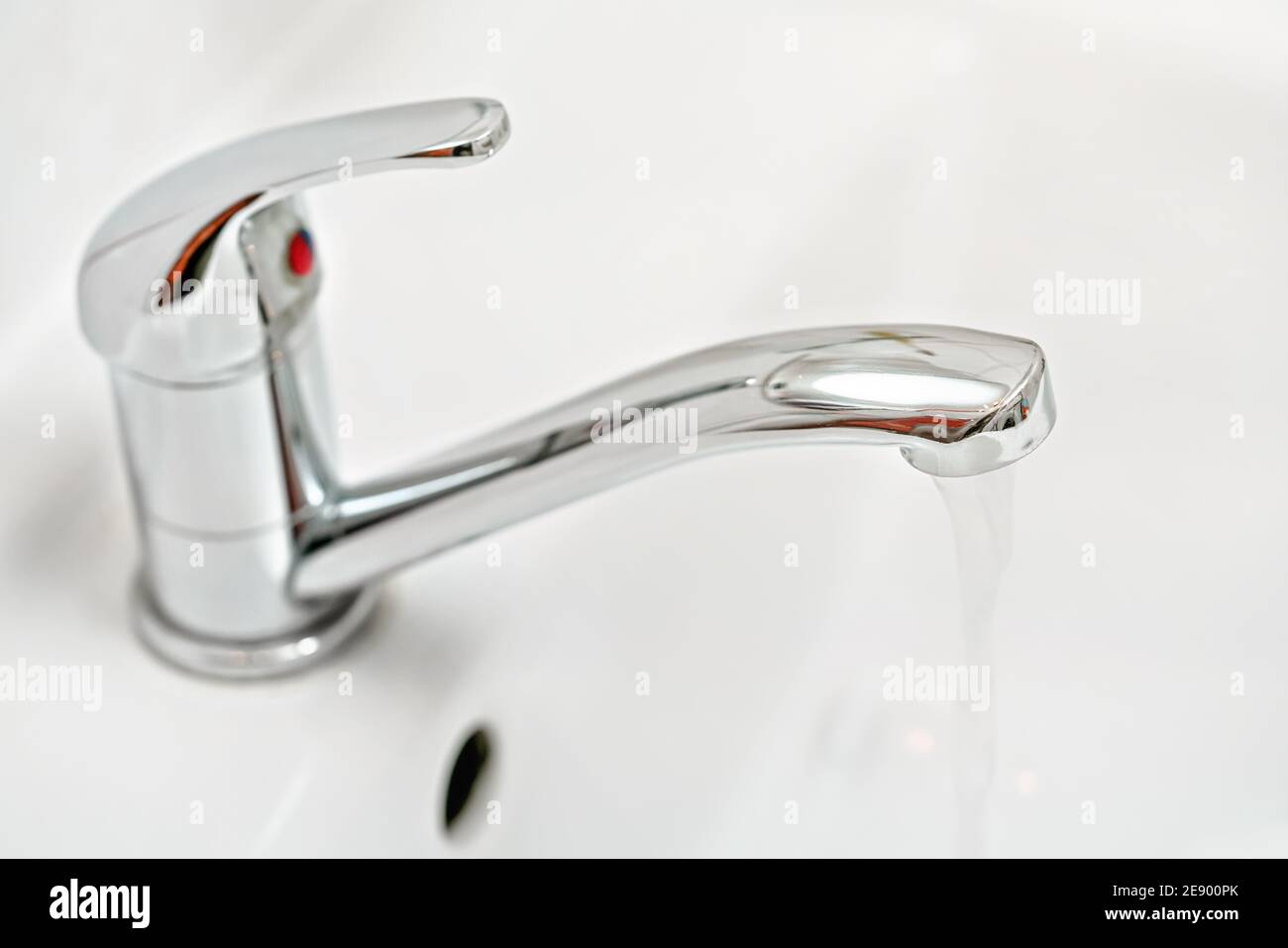 Chrome Tap Faucet With Water Flowing Blurred Bathroom Background Stock