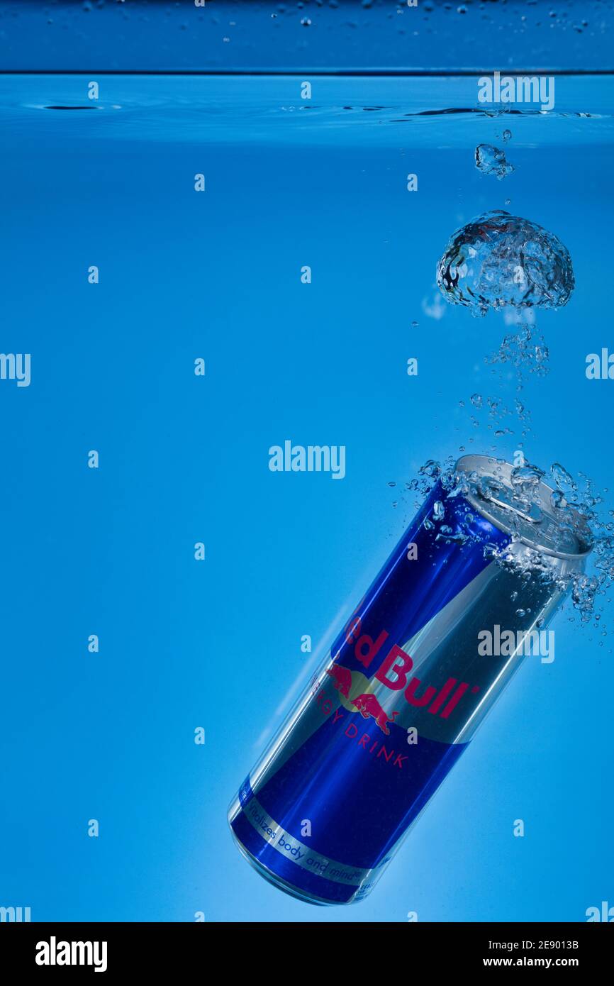 Freeze motion photo of a can of Red Bull dropped into water Stock Photo ...