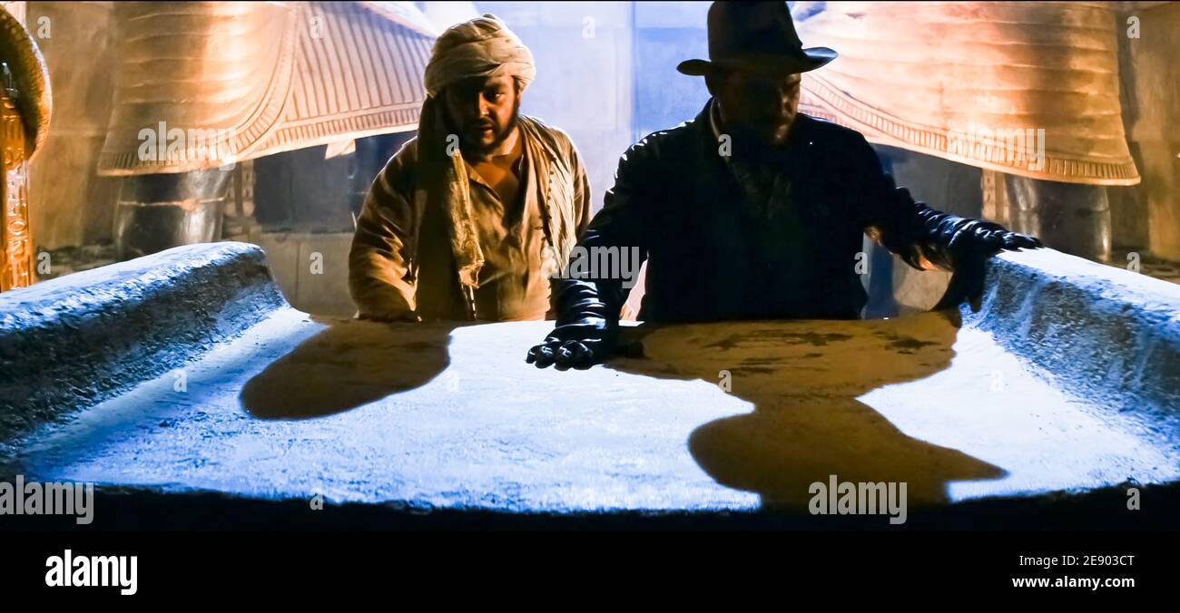 USA. John Rhys-Davies and Harrison Ford in a scene from the (C ...