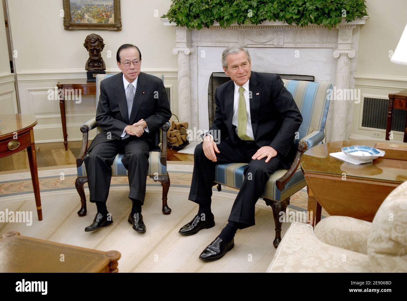 US President George W. Bush shakes hands with Japanese Prime Minister ...