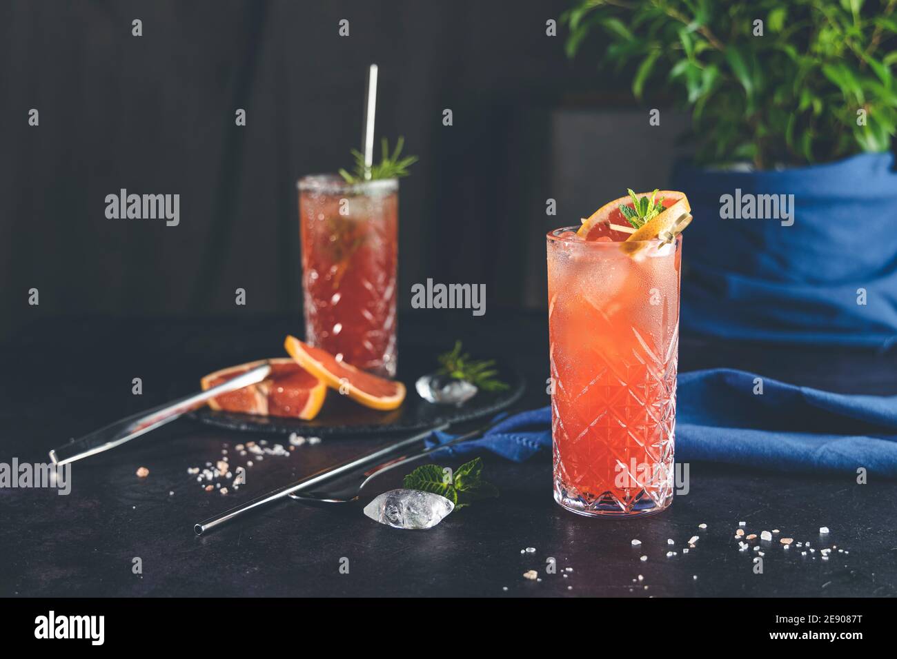 Pink Grapefruit Mezcal Paloma Cocktail in highball glass with water ...