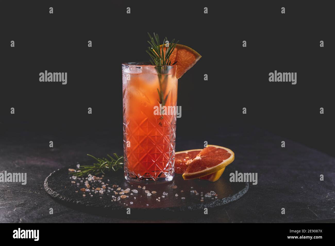 Pink Grapefruit Mezcal Paloma Cocktail in highball glass with water ...