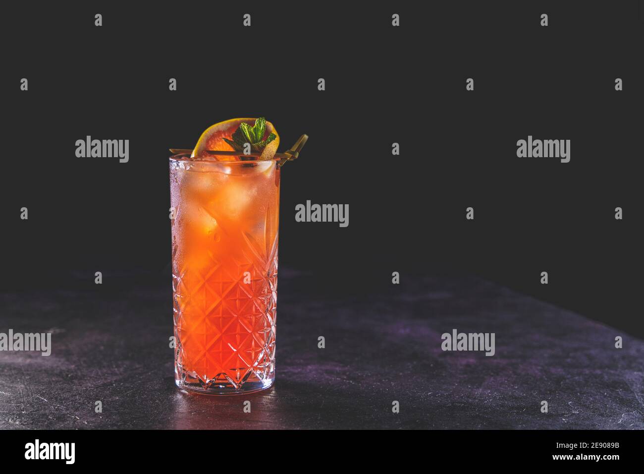 Pink Grapefruit Mezcal Paloma Cocktail in highball glass with water ...