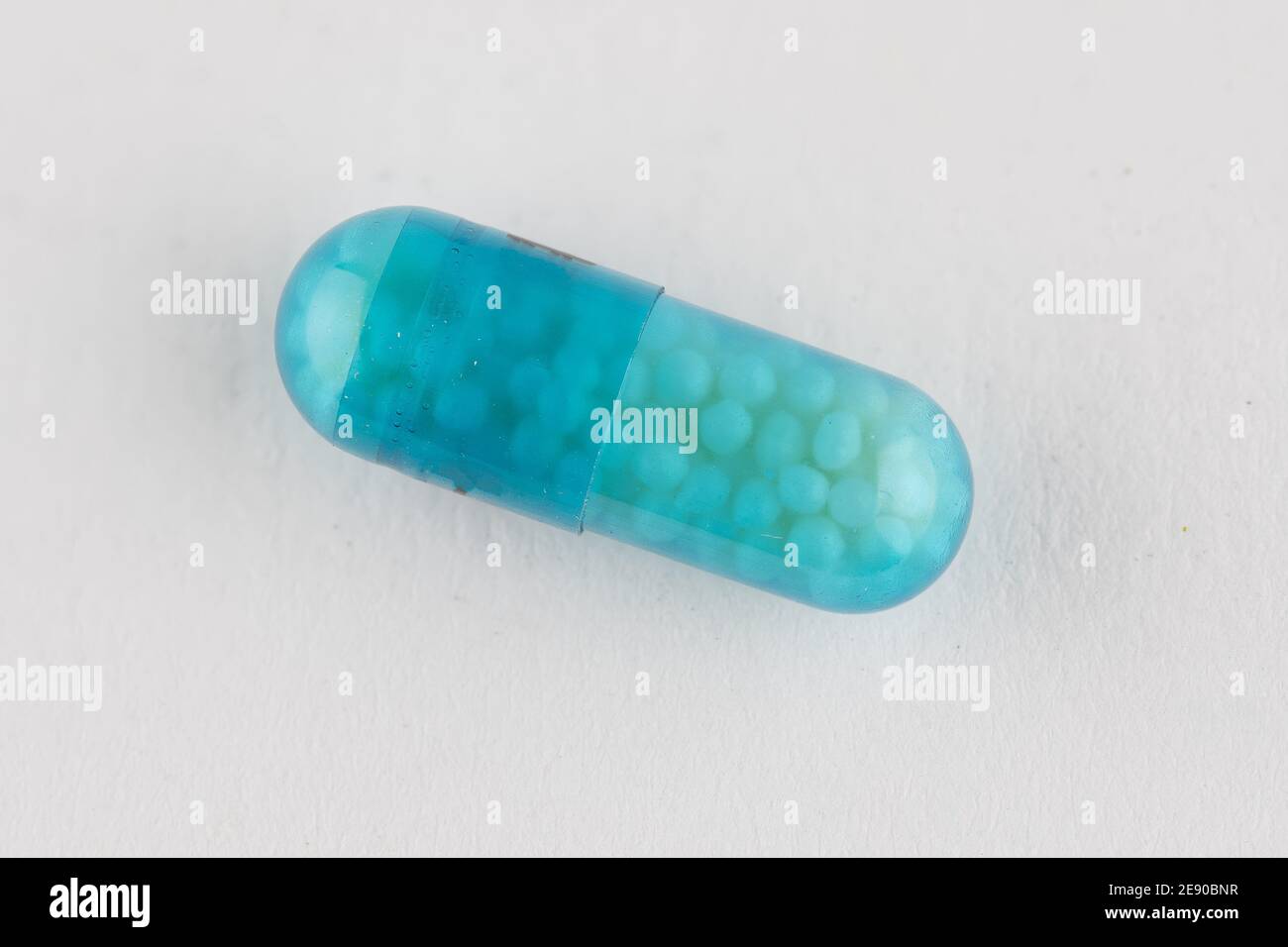 Macro image of a blue translucent tablet capsule allowing you to see ...
