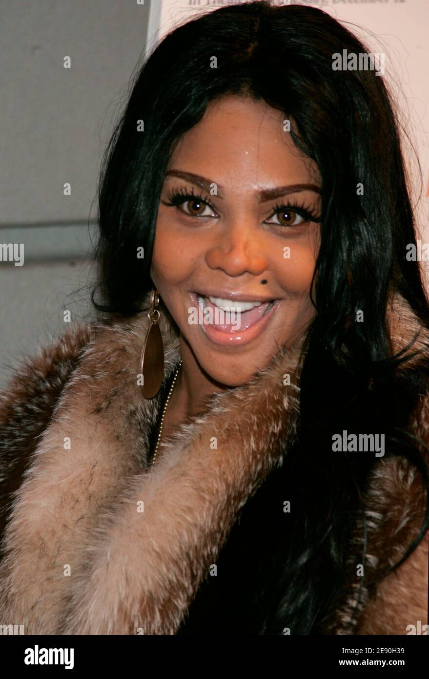Rapper Lil Kim poses at 'The Perfect Holiday' cast party, held at club ...
